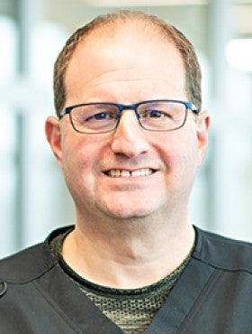 Mitchell E. Cooper, MD